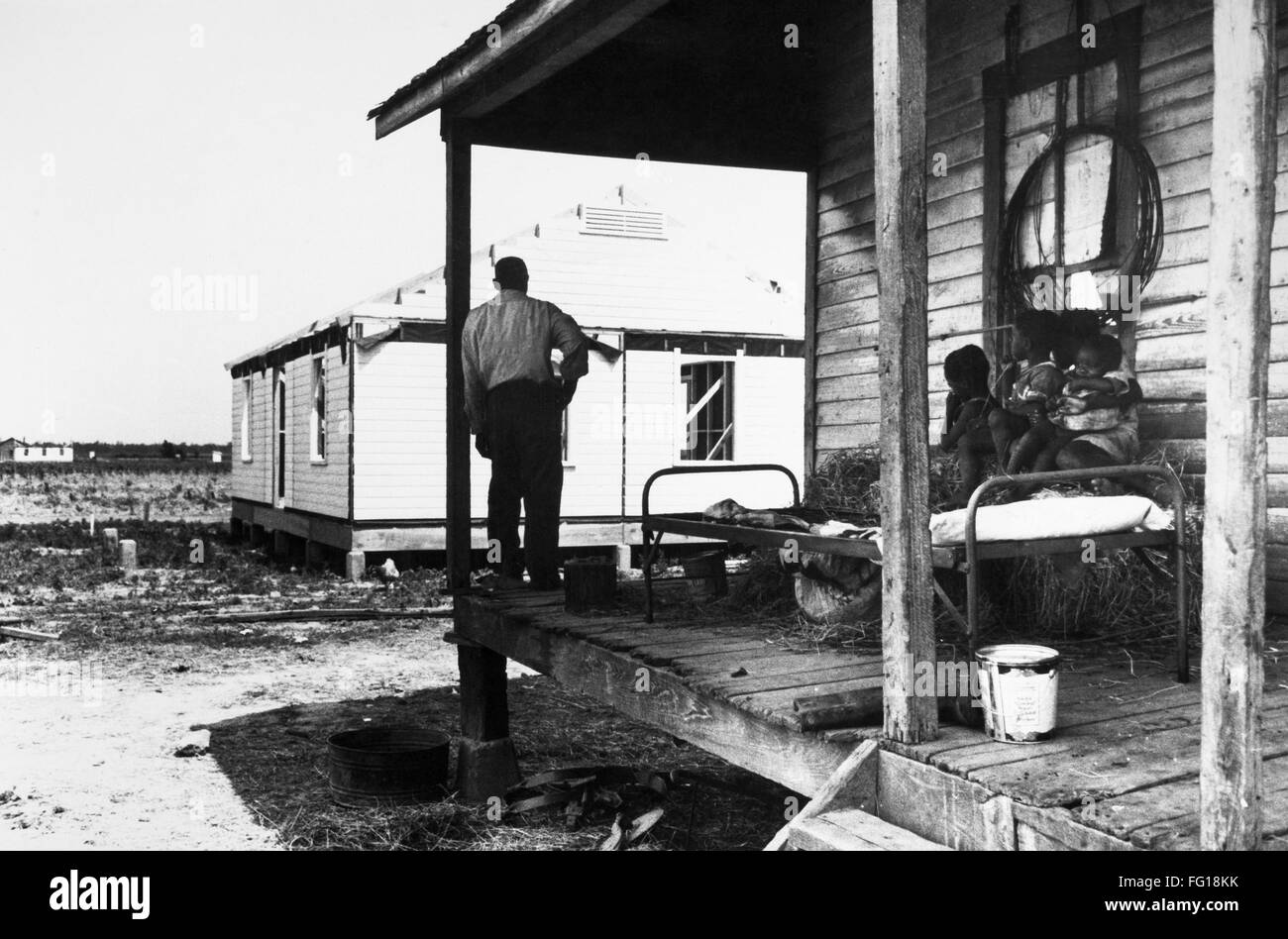 MISSOURI: SHARECROPPERS. /nA sharecropper family looking at their new ...