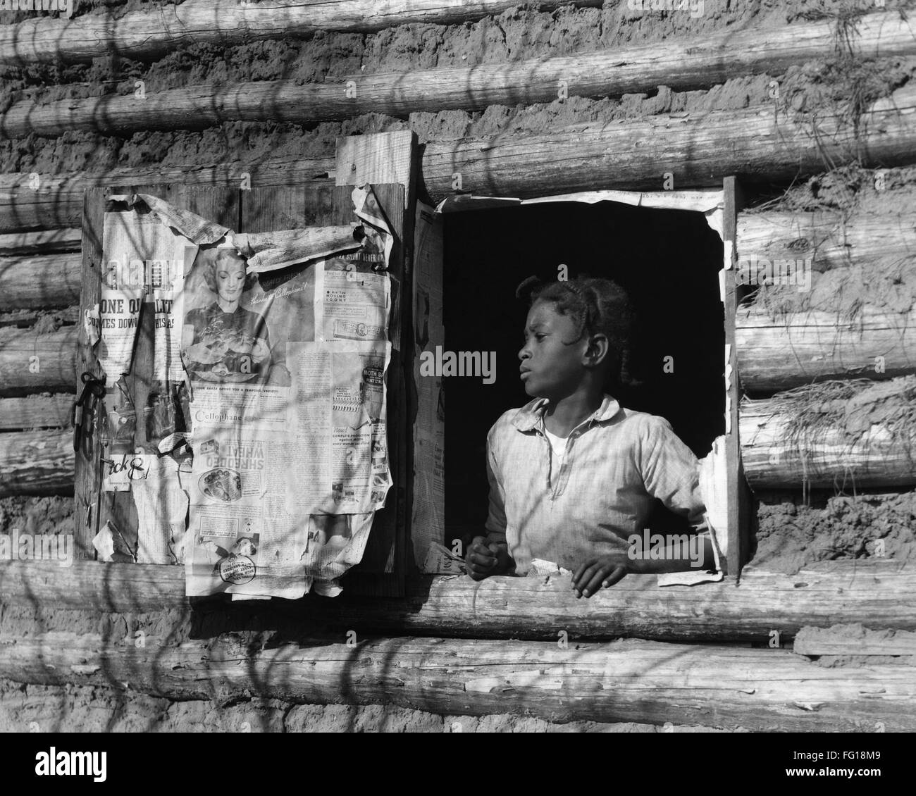 ALABAMA: GIRL, 1937. /nA girl in the window of her home at Gees Bend ...