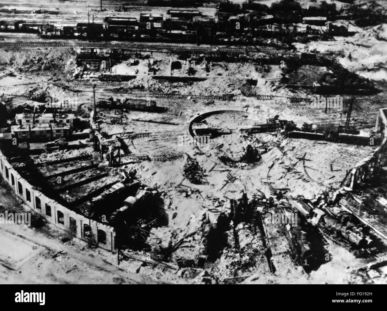 WORLD WAR II: AIR RAID. /nRuins of several locomotives and a roundhouse ...