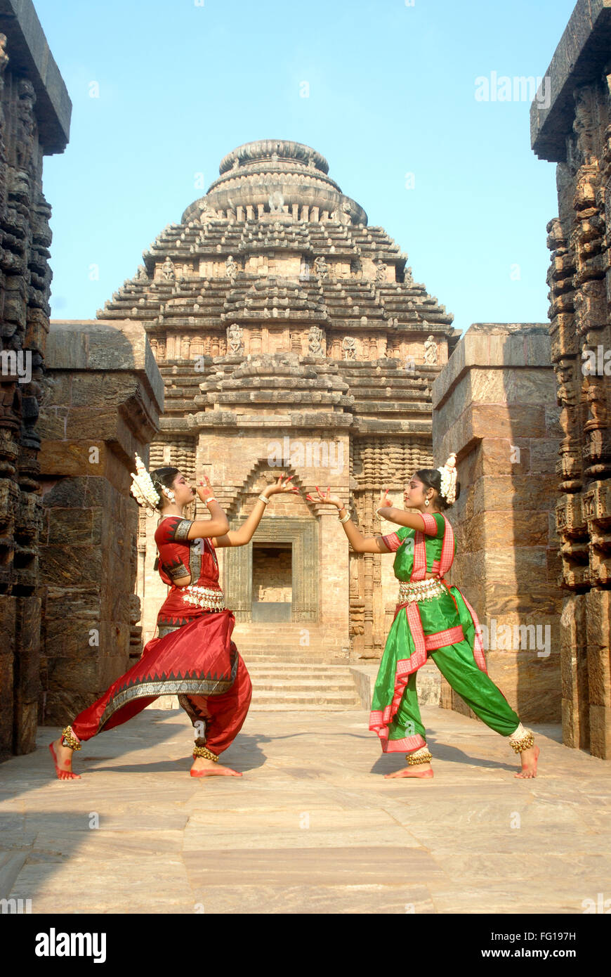 Dancers performing classical traditional odissi dance in front of Konarak Sun temple , Konarak ...