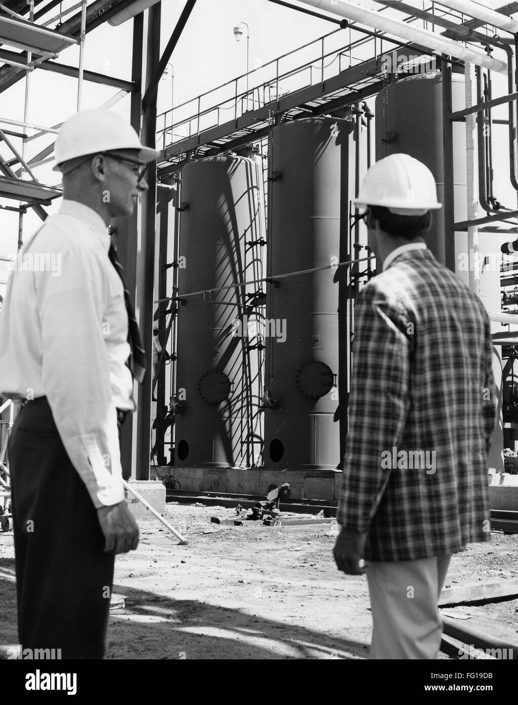 DOW CHEMICAL COMPANY. /nTwo workers of the Dow Chemical Company at the ...