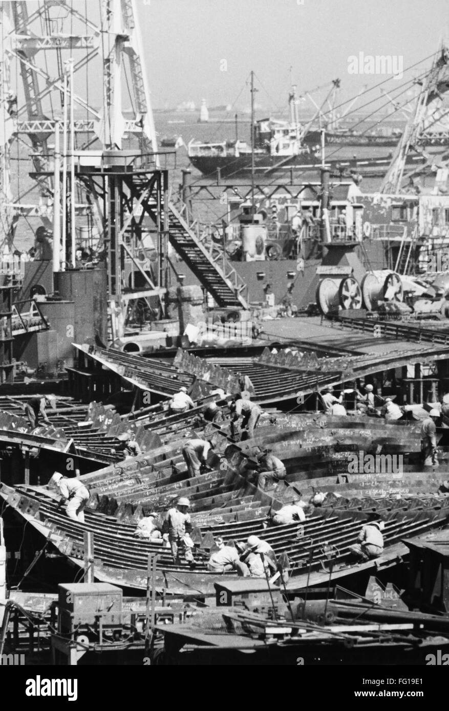 JAPAN: SHIPYARD, 1962. /nWorkers assembling the hull of a ship at the ...