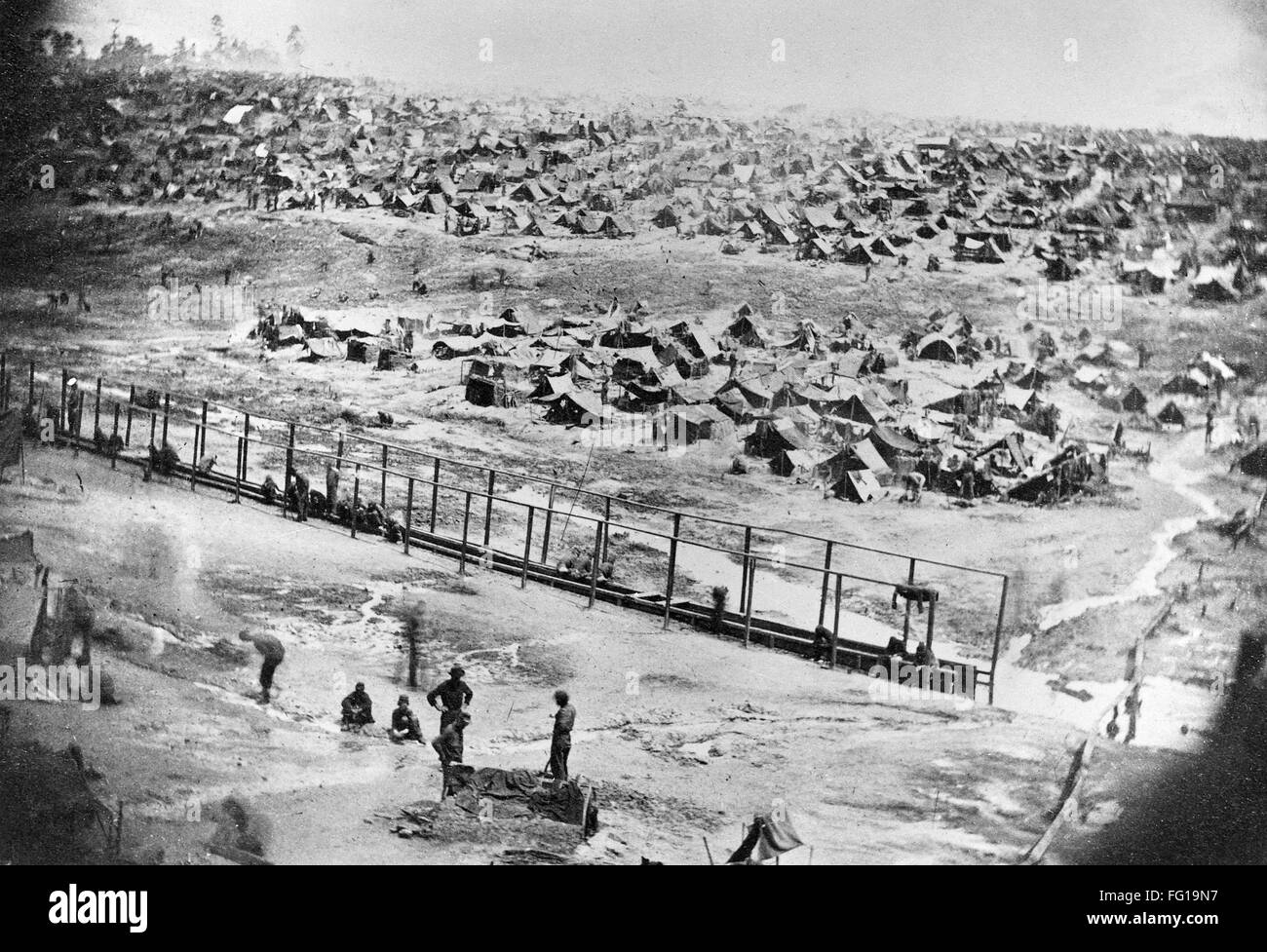 ANDERSONVILLE PRISON, 1864. /nView of the latrines and tents at ...