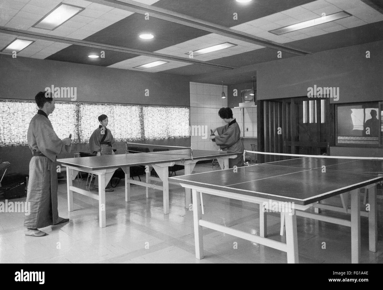 JAPAN: GAME ROOM. /nA Japanese men and women ping pong. Photograph, mid ...
