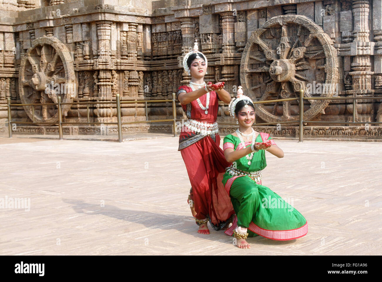 Dancers performing classical traditional odissi dance in front of Konarak Sun temple , Konarak ...