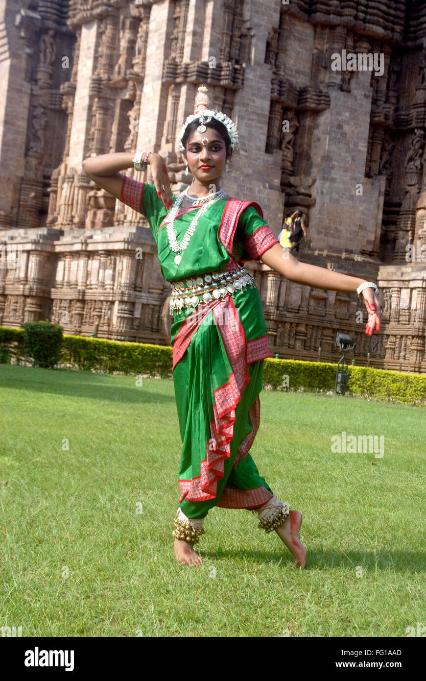 Dancer performing classical traditional odissi dance at Konarak Sun temple , Konarak , Orissa ...