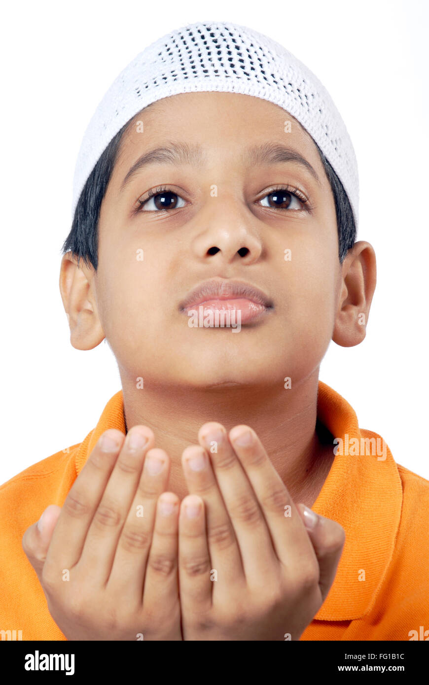 Muslim boy wearing topi praying namaz MR#152 Stock Photo - Alamy
