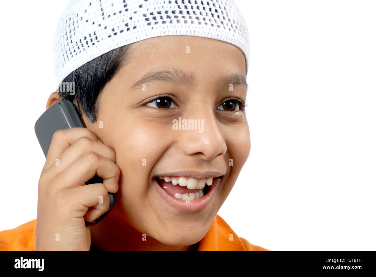 Muslim boy talking on cell phone MR#152 Stock Photo - Alamy