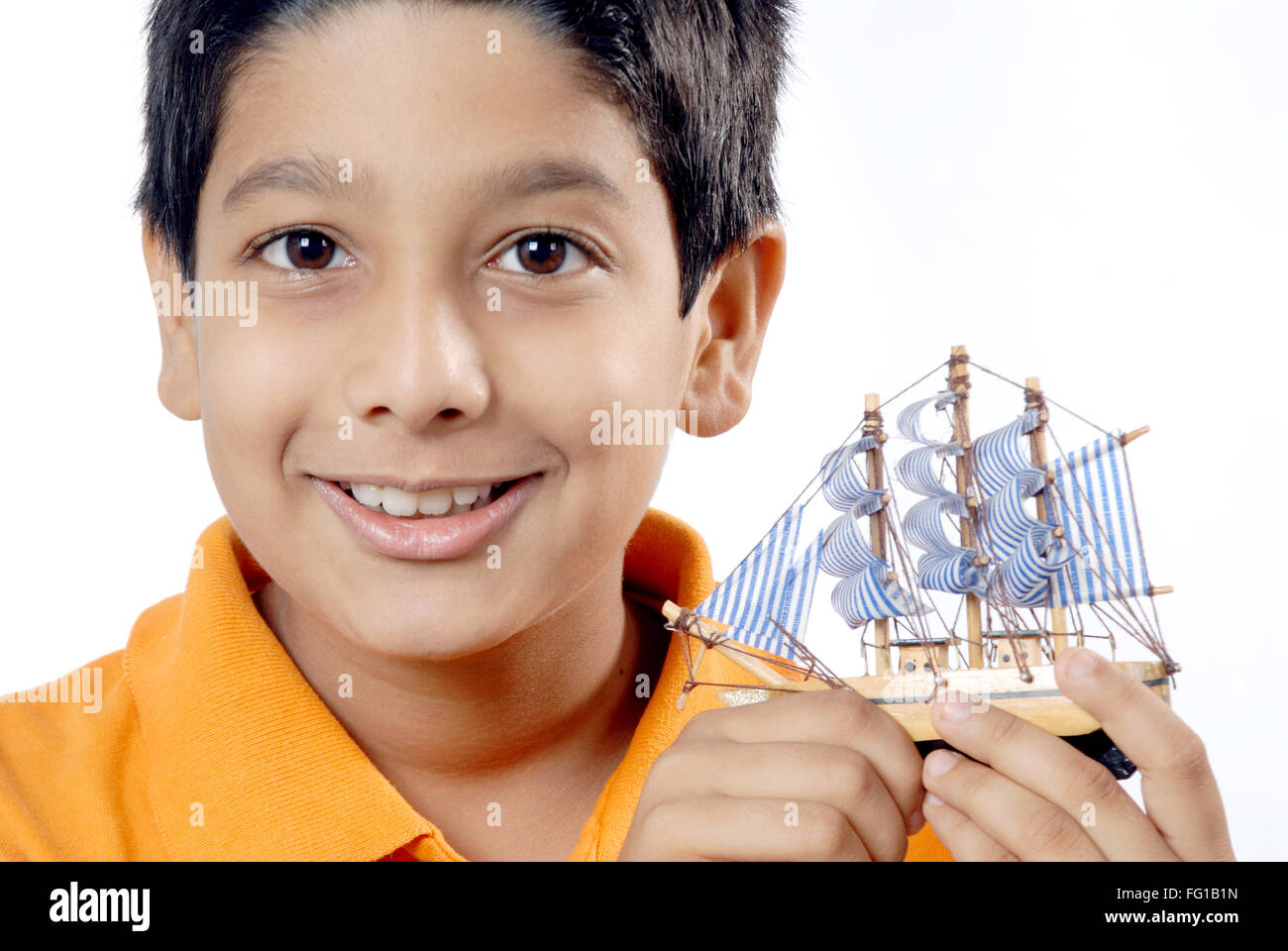 Boy showing old ship model dreaming for future MR#152 Stock Photo - Alamy