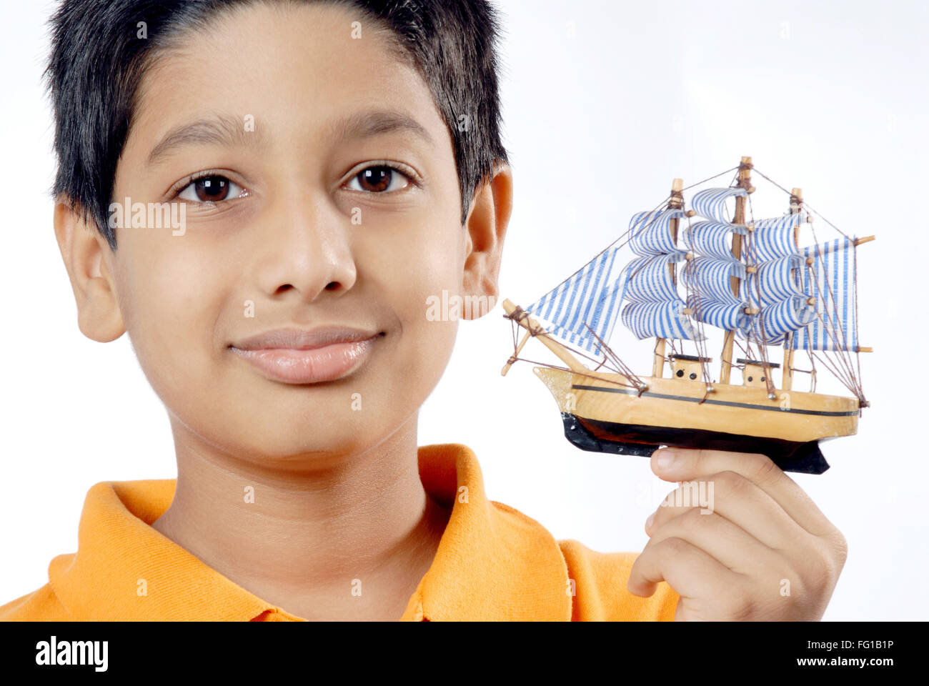 Boy showing old ship model dreaming for future MR#152 Stock Photo - Alamy