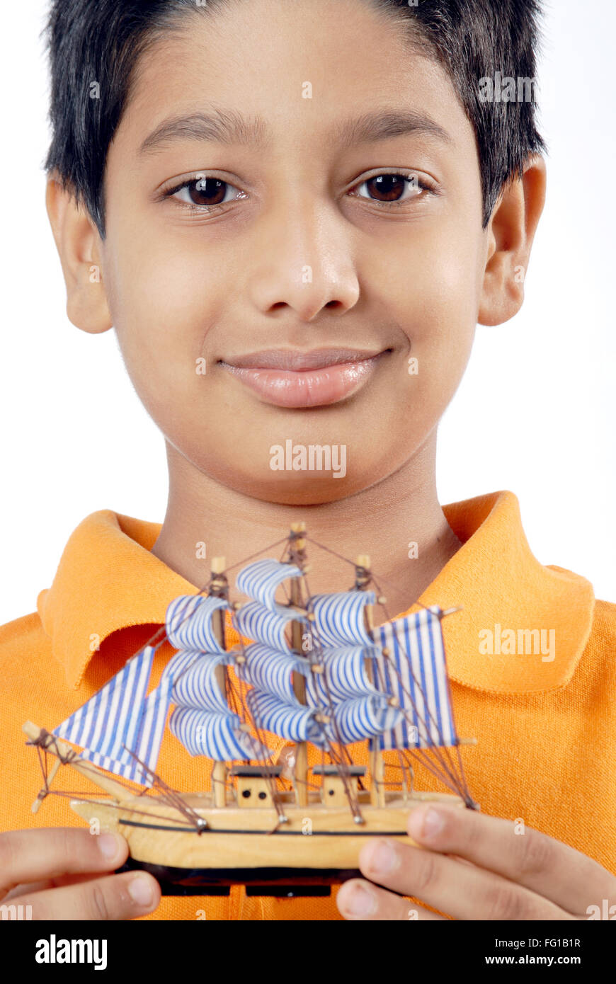 Boy showing old ship model dreaming for future MR#152 Stock Photo - Alamy