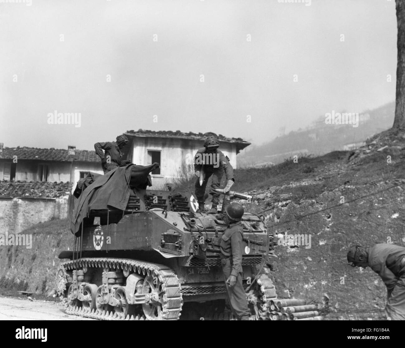 WWII: HOWITZER, 1945. Soldiers of the 758th Tank Battalion fire their ...