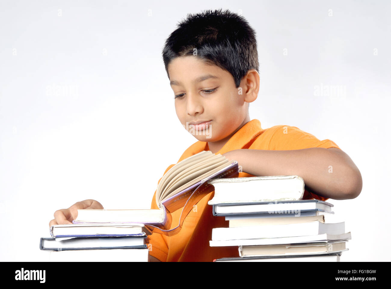 Boy looking at book MR#152 Stock Photo - Alamy