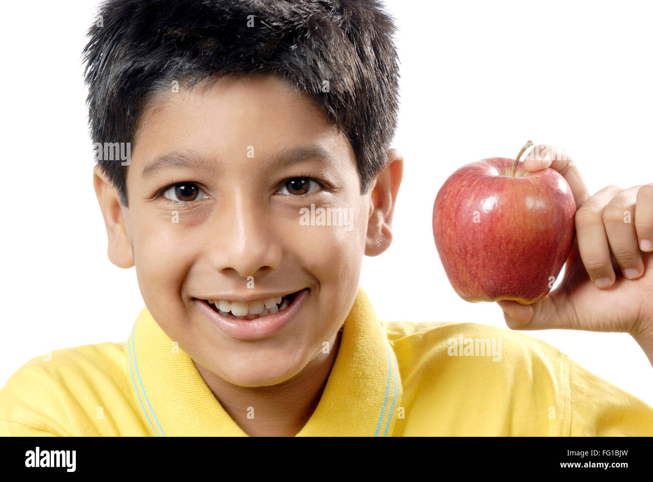 Young boy showing apple in hand MR#152 Stock Photo - Alamy