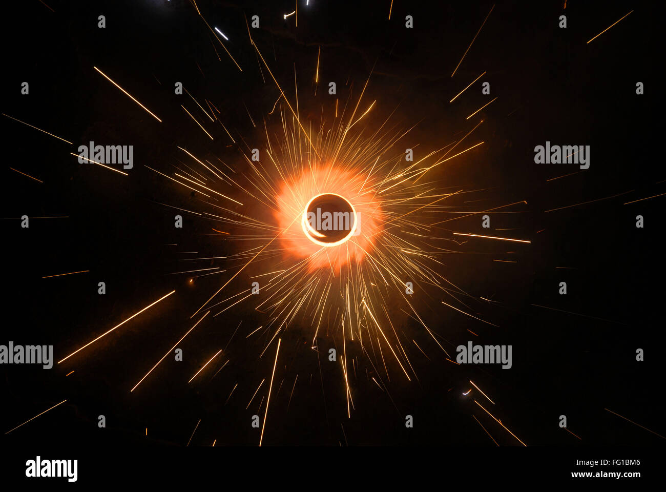 Fire cracker burning Stock Photo - Alamy