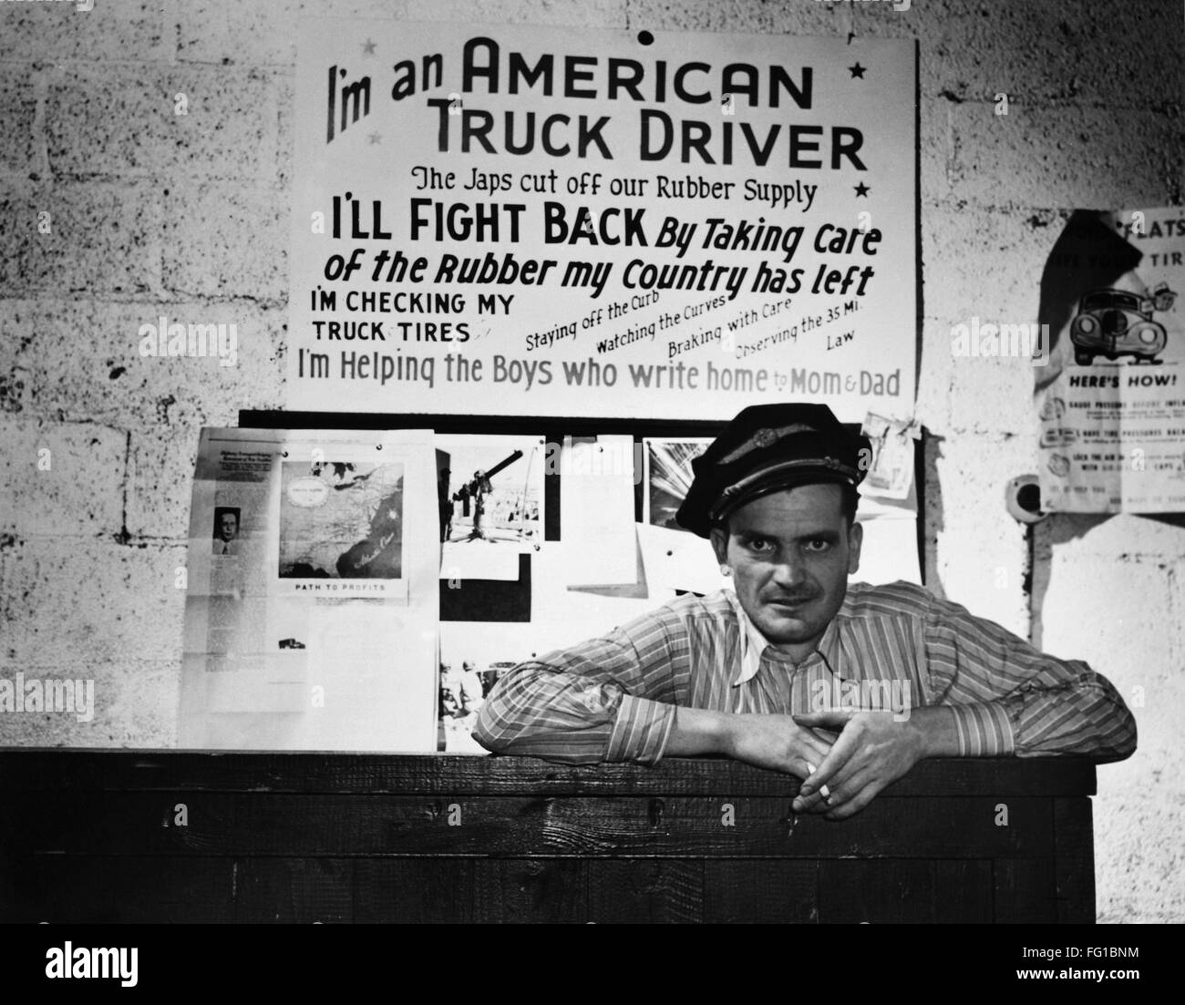 WWII: HOMEFRONT, c1943. /nA man with a poster promoting rubber ...
