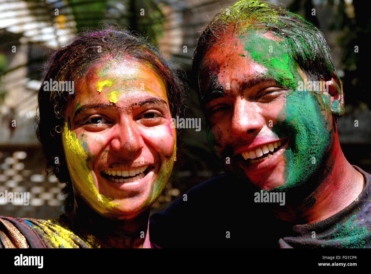 Coloured face of couple enjoying holi festival MR#364 Stock Photo - Alamy