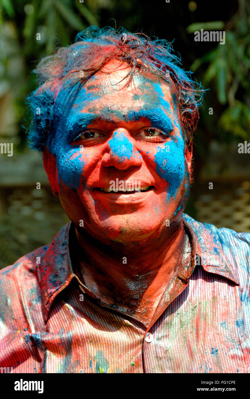 Coloured face of man enjoying holi festival MR#364 Stock Photo - Alamy