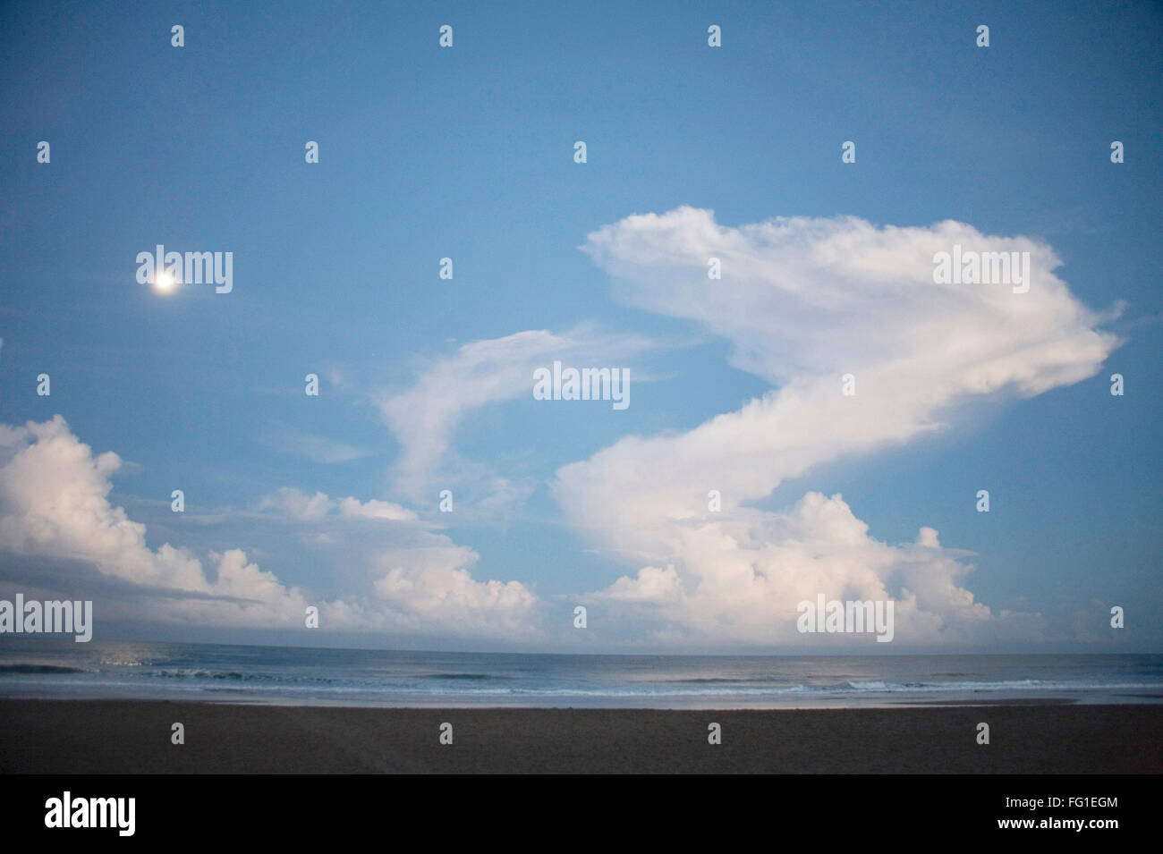 Blue sky with moon and clouds , Palolem beach , Goa , India Stock Photo ...