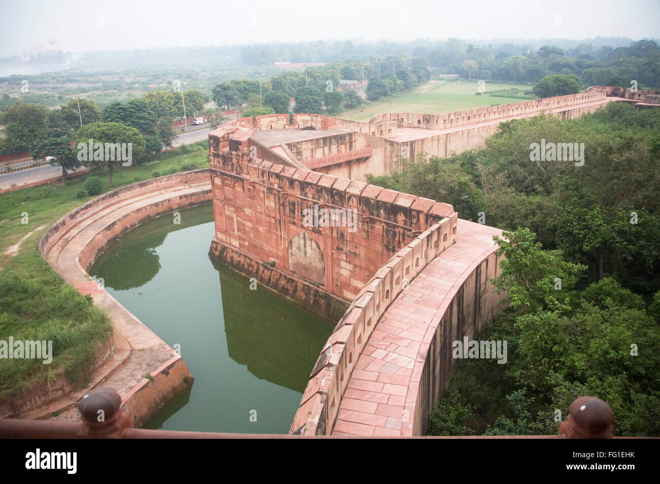 Sand stone wall and water canal moat for safety of Agra Fort , Agra ...