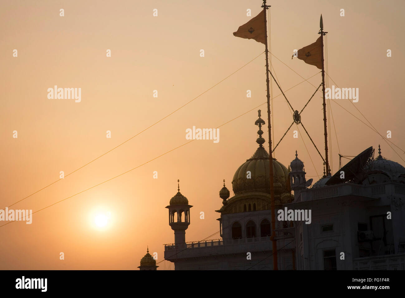 Akal takht flag during sunset swarn mandir or golden temple , Amritsar ...