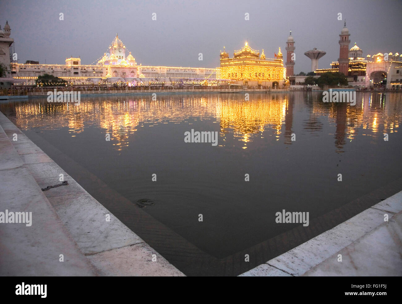 Illuminated Harimandir Sahib swarn mandir or golden temple reflection ...