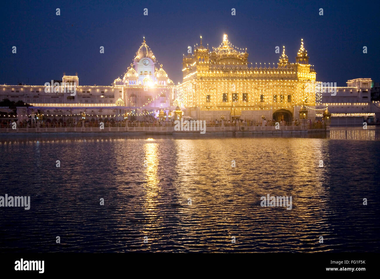 Illuminated Harimandir Sahib swarn mandir or golden temple during ...