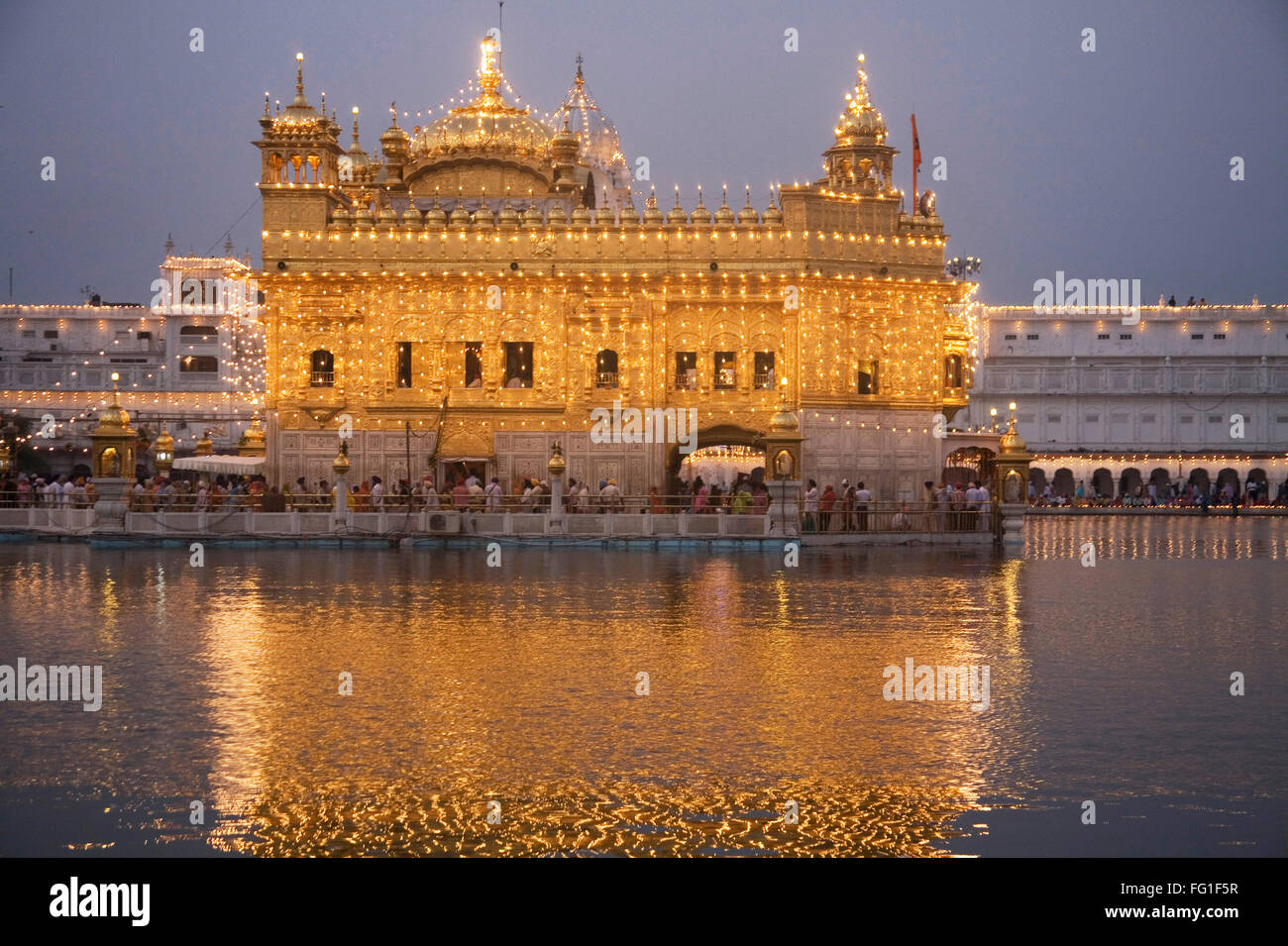 Illuminated Harimandir Sahib swarn mandir or golden temple during ...