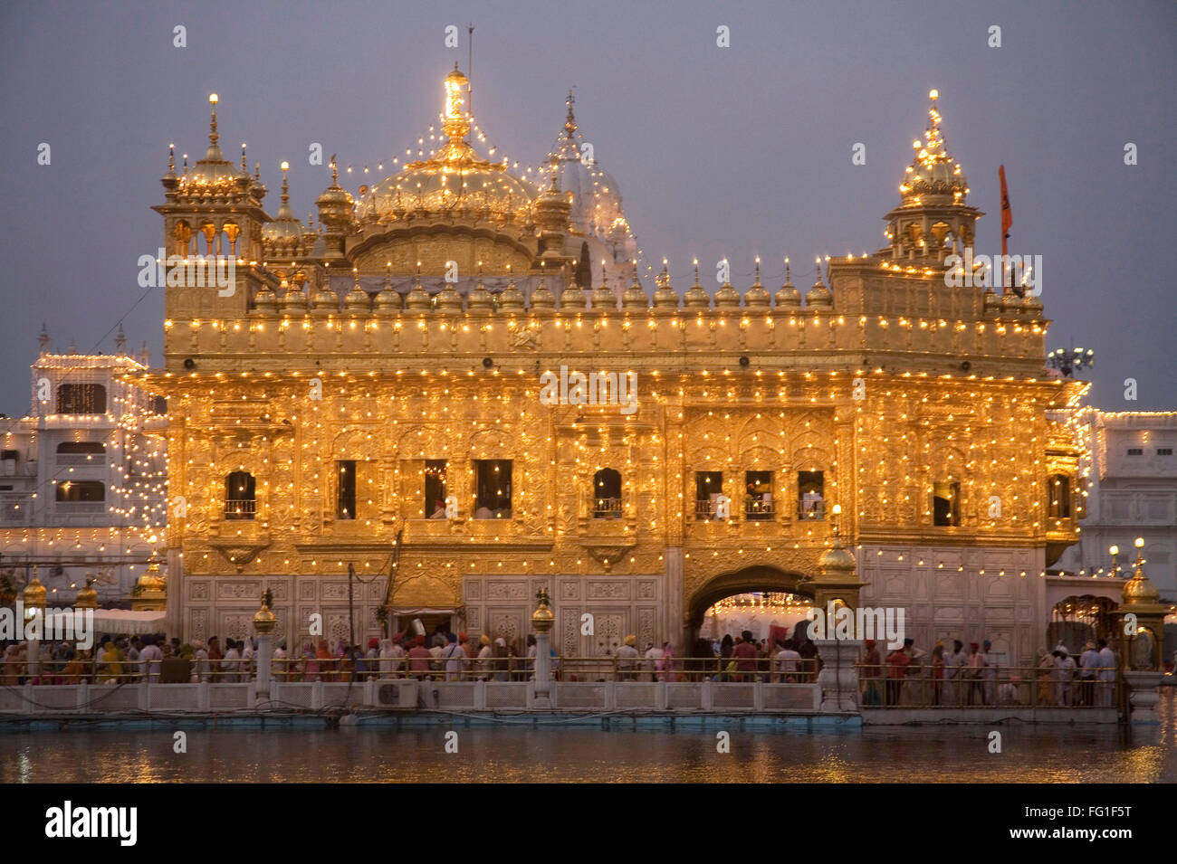 Illuminated Hari Mandir Sahib swarn mandir or golden temple during ...