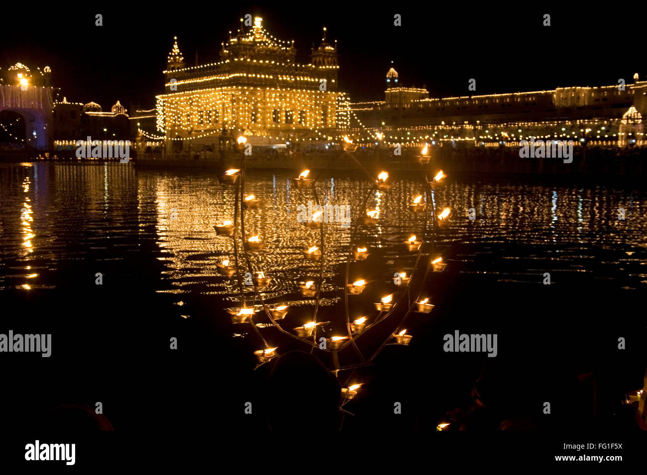 Illuminated Harimandir Sahib swarn mandir or golden temple during ...