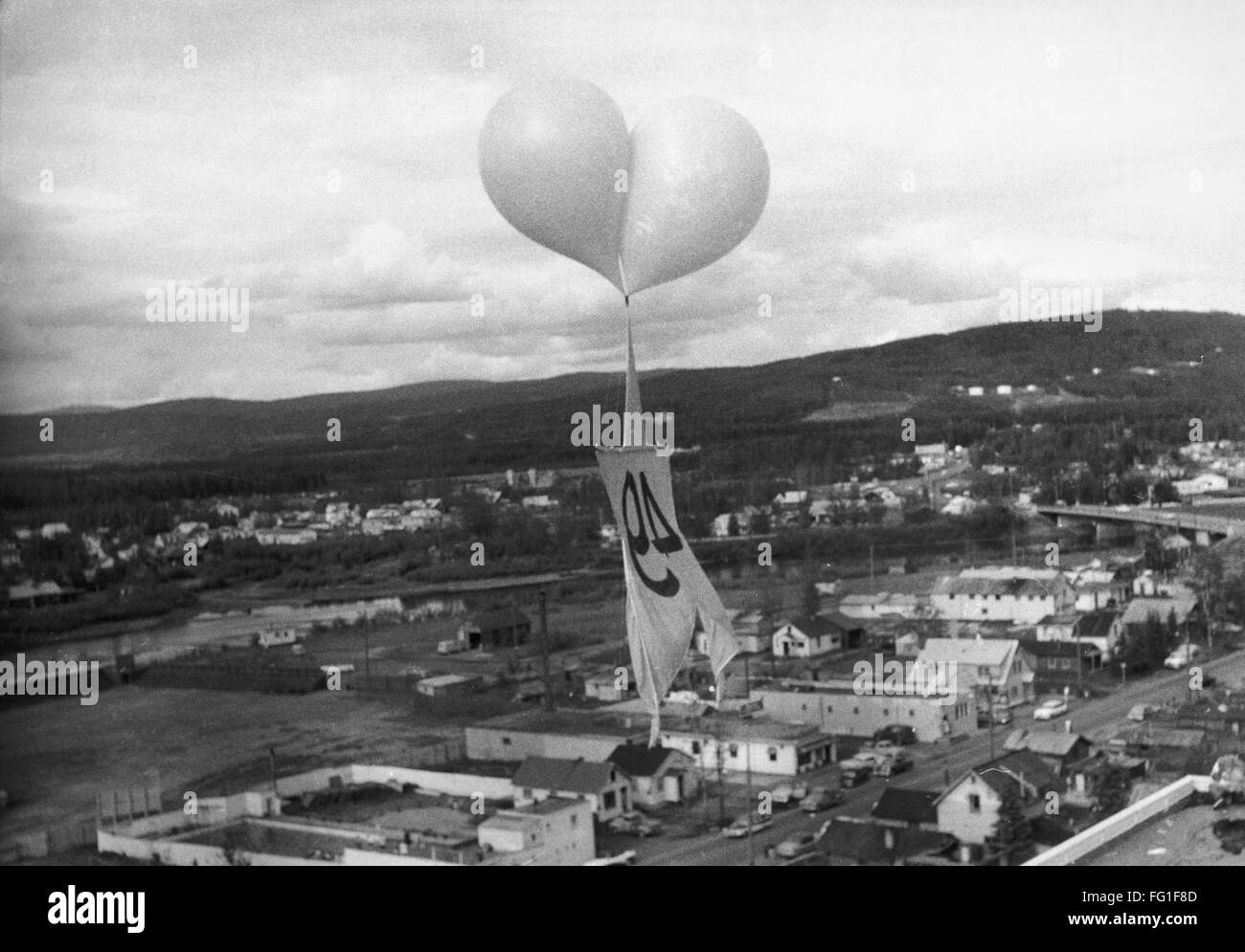 ALASKA: STATEHOOD, 1958. /nTwo balloons carrying a banner with the ...