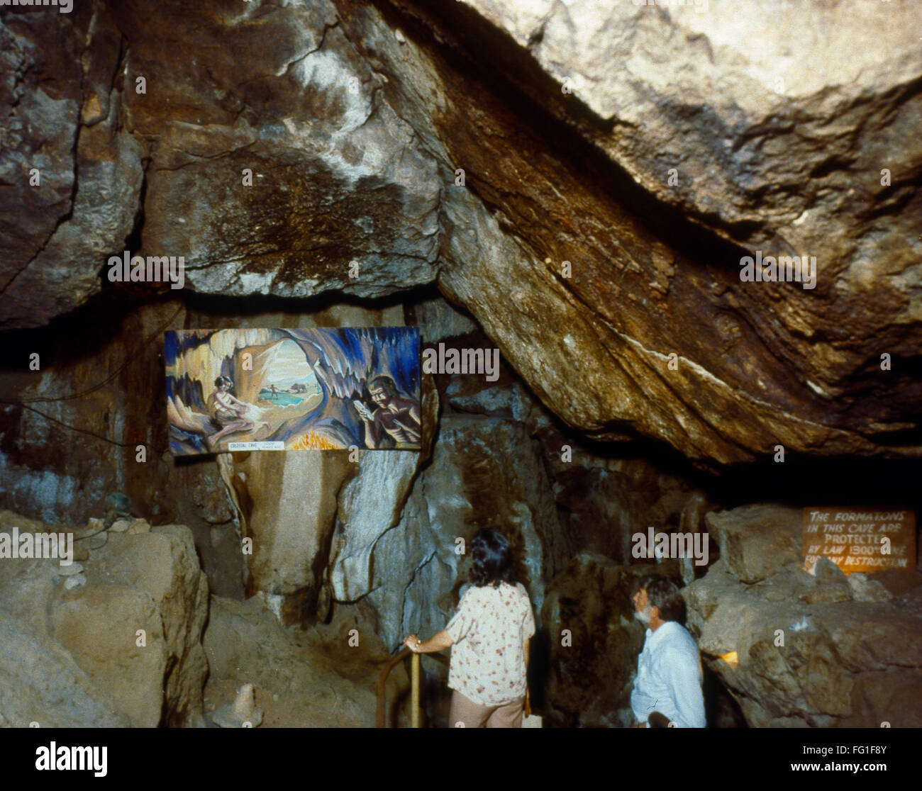 ARIZONA: COLOSSAL CAVE. /nVisitors viewing a mural of prehistoric cave ...