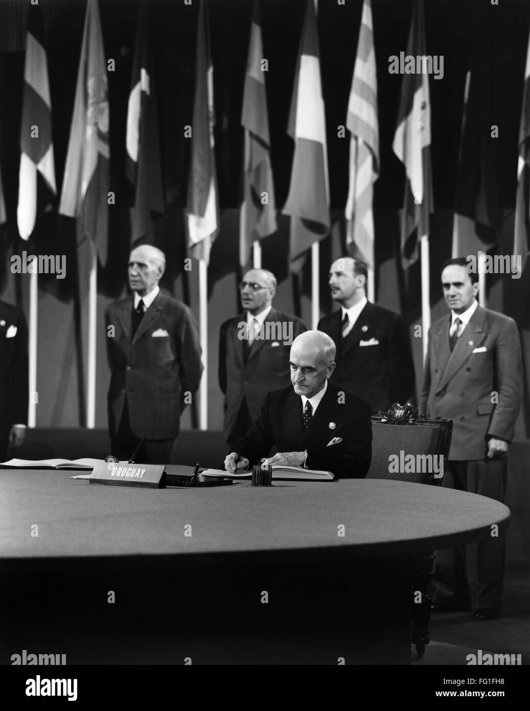 UNITED NATIONS, 1945. /nA member of the delegation from Uruguay signing ...