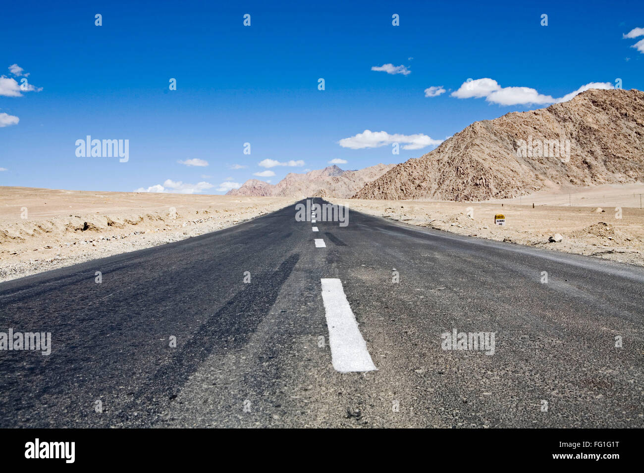 Tar bitumen stretch on Leh Kargil road in typical Ladakh landscape ...