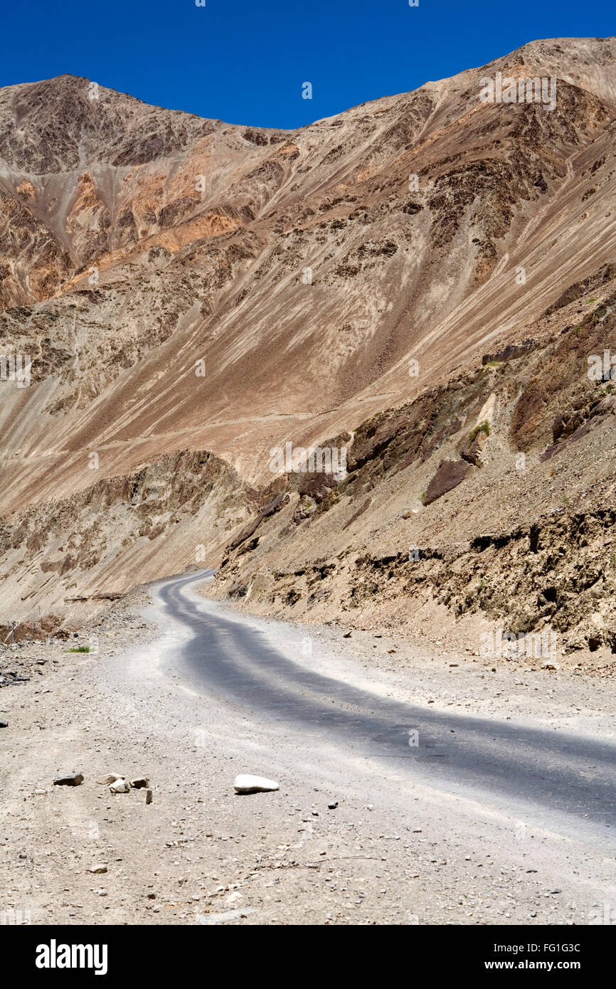 Narrow tar bitumen road on Leh Kargil road stretch in barren cold ...