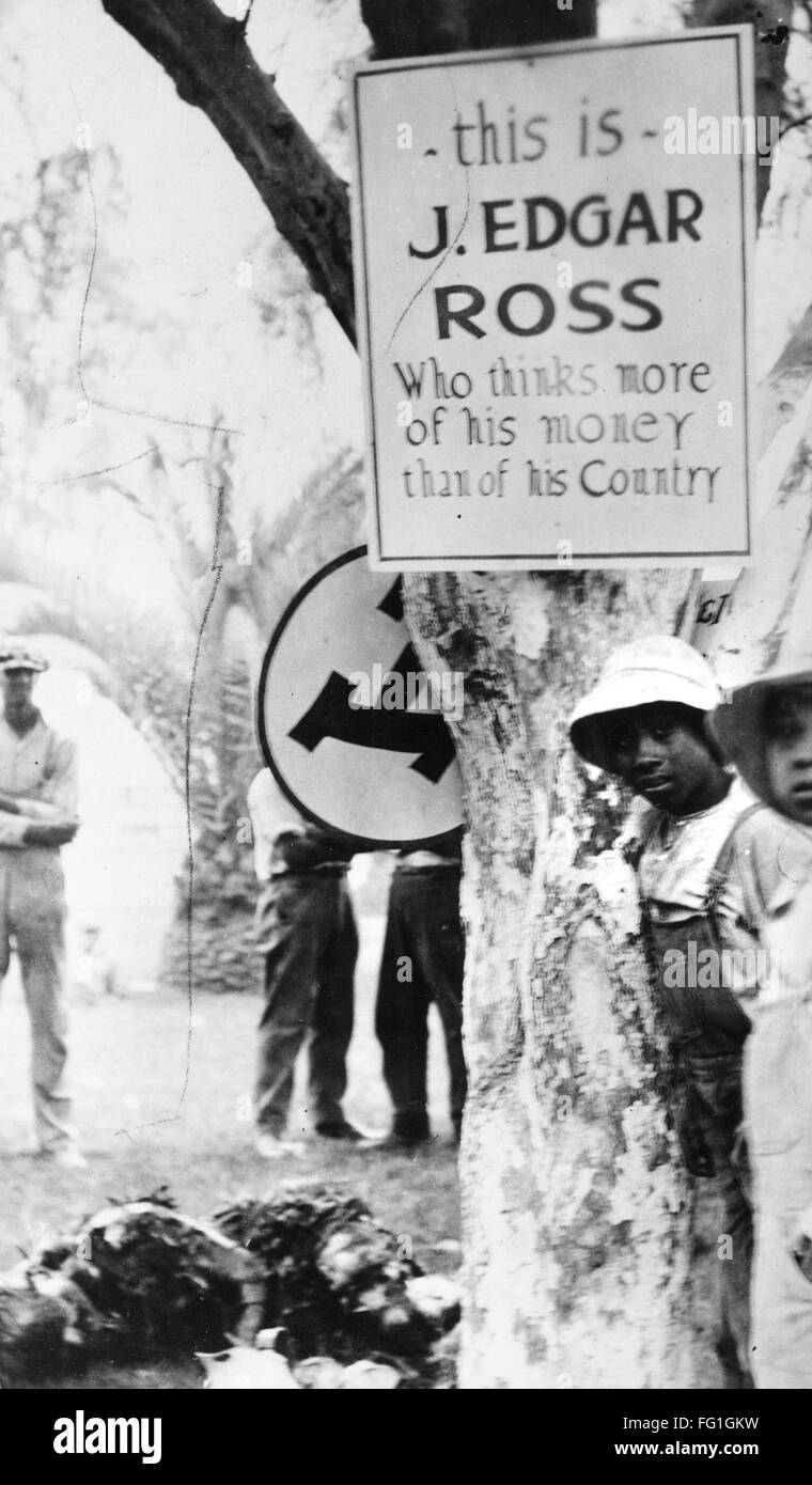 TARRING & FEATHERING, 1918. /nJ. Edgar Ross, a beekeeper, lying on the ...