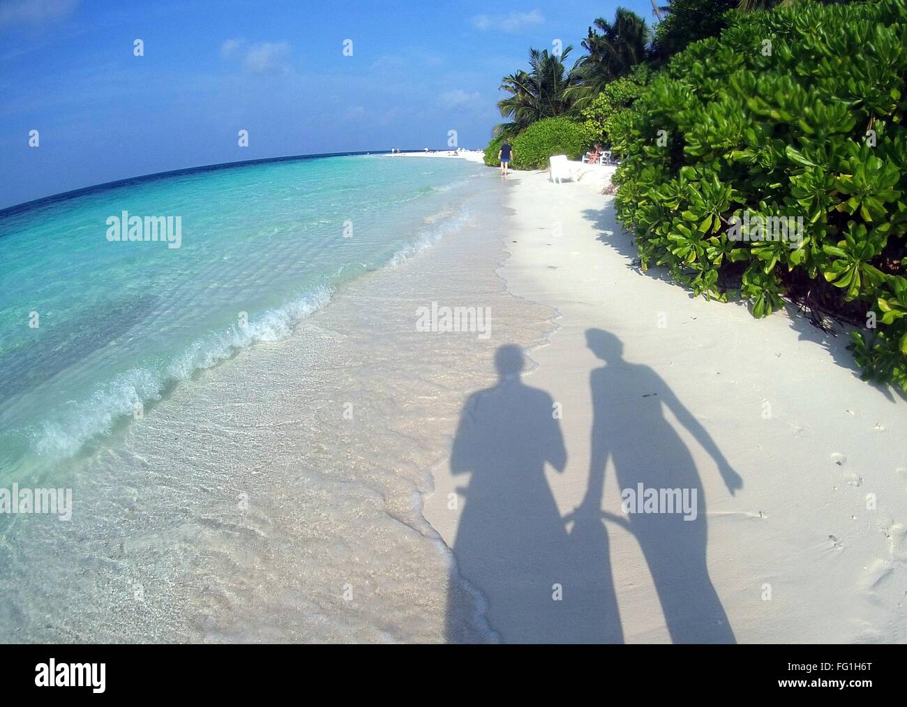 Shadow Of People On Beach By Sea Stock Photo - Alamy