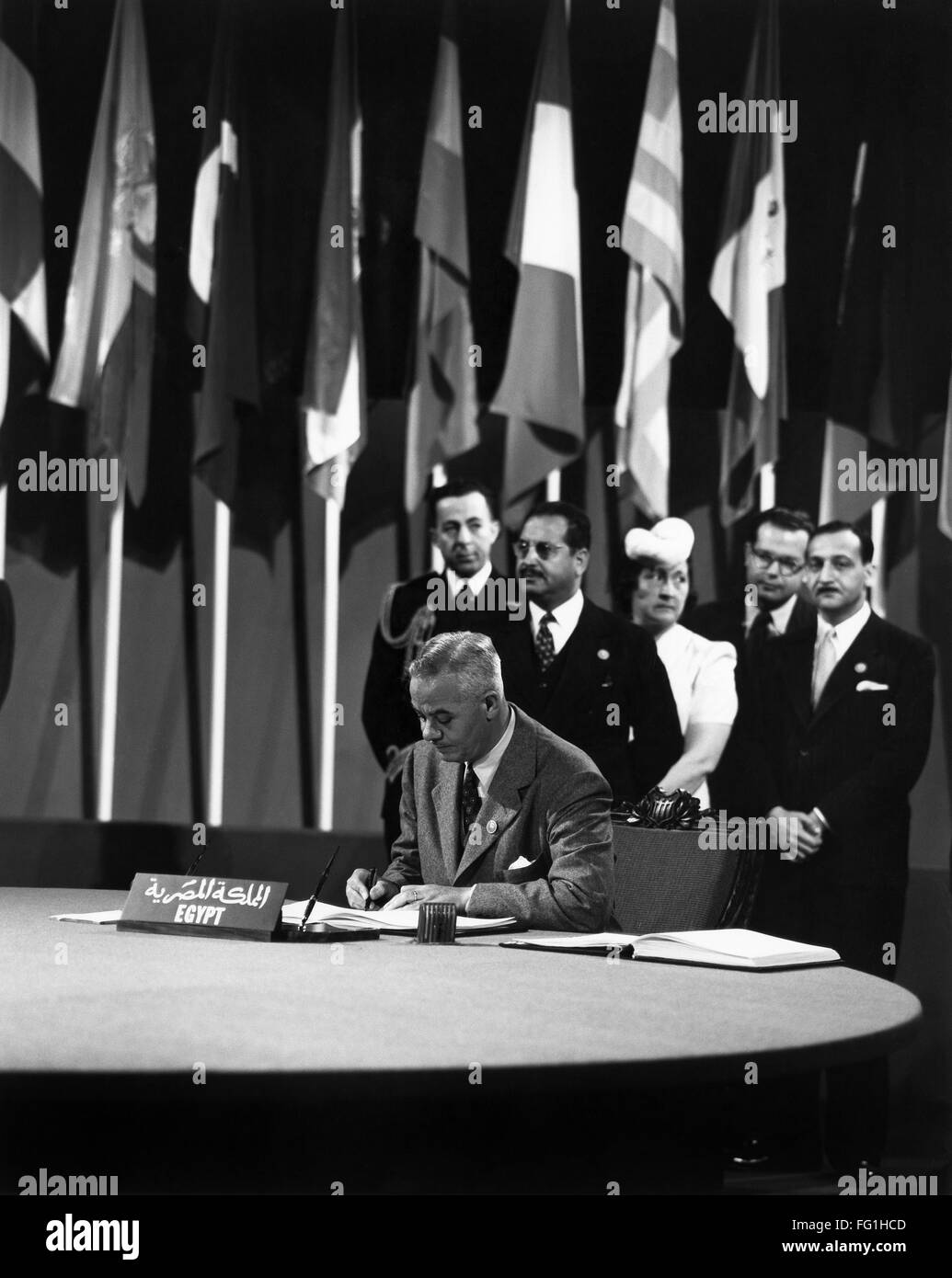 UNITED NATIONS, 1945. /nA member of the delegation from Egypt signing ...