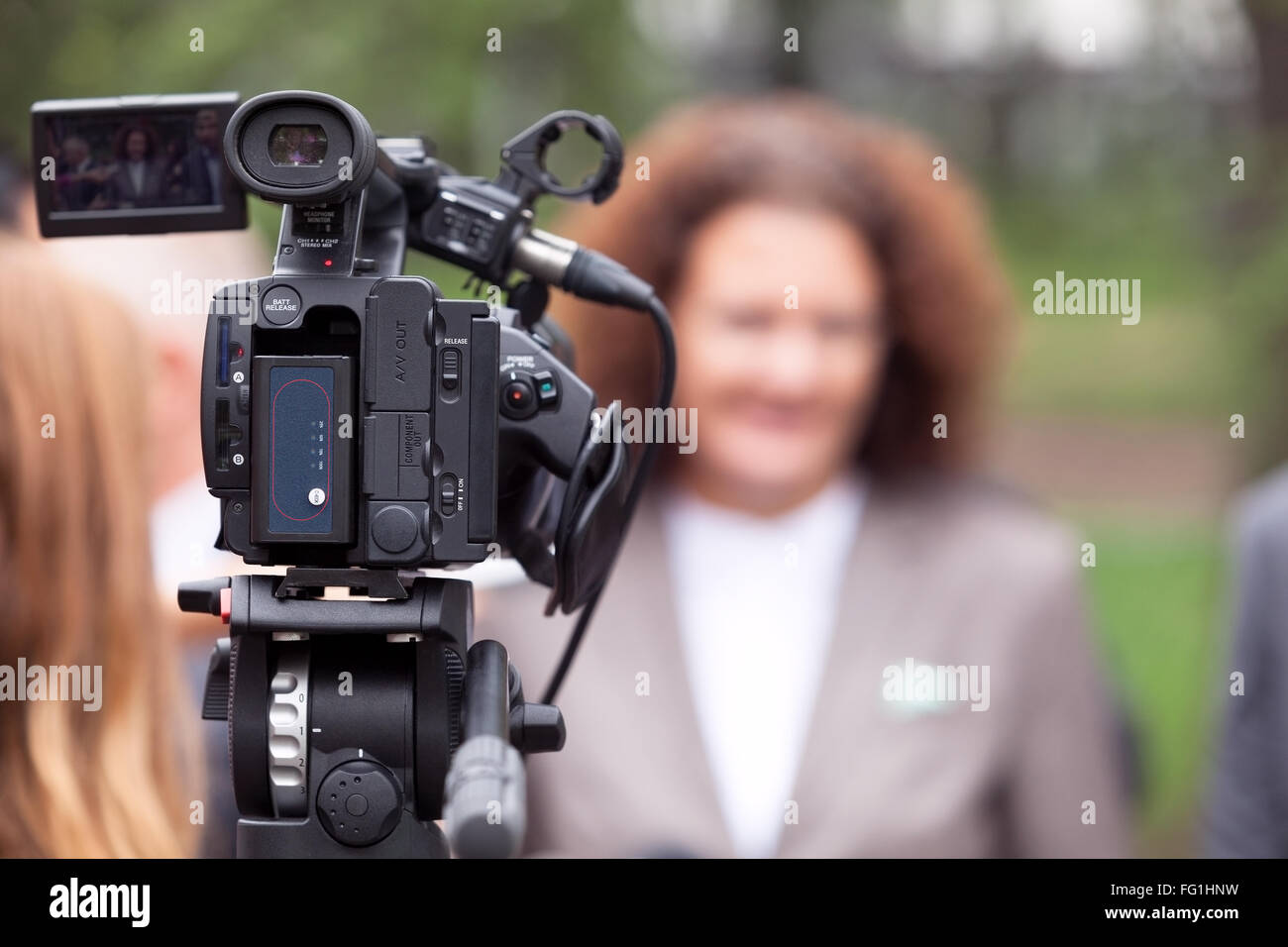 Filming an event with a video camera Stock Photo - Alamy