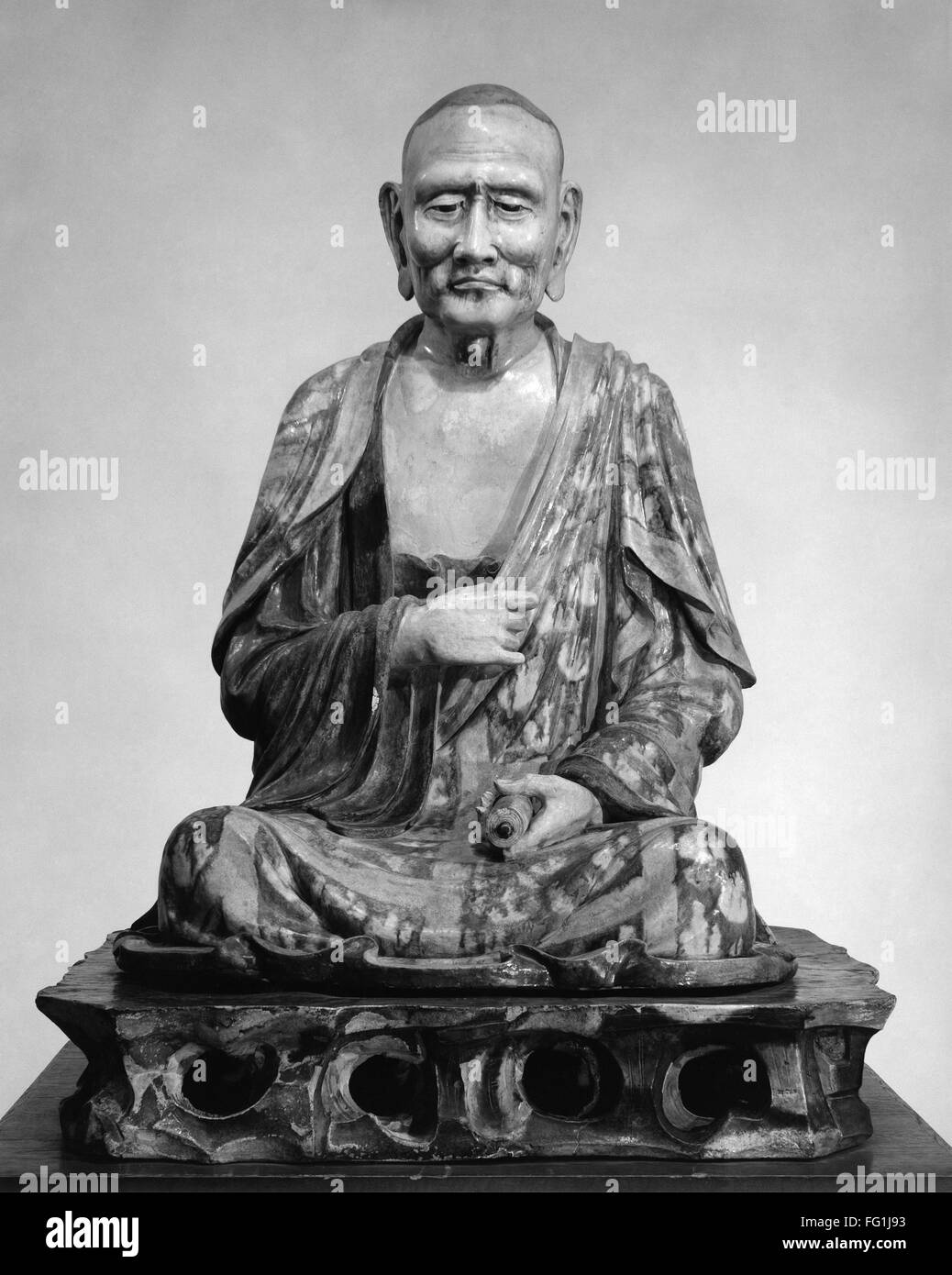 CHINA: LOHAN FIGURE. /nGlazed stoneware figure of a Lohan, which ...
