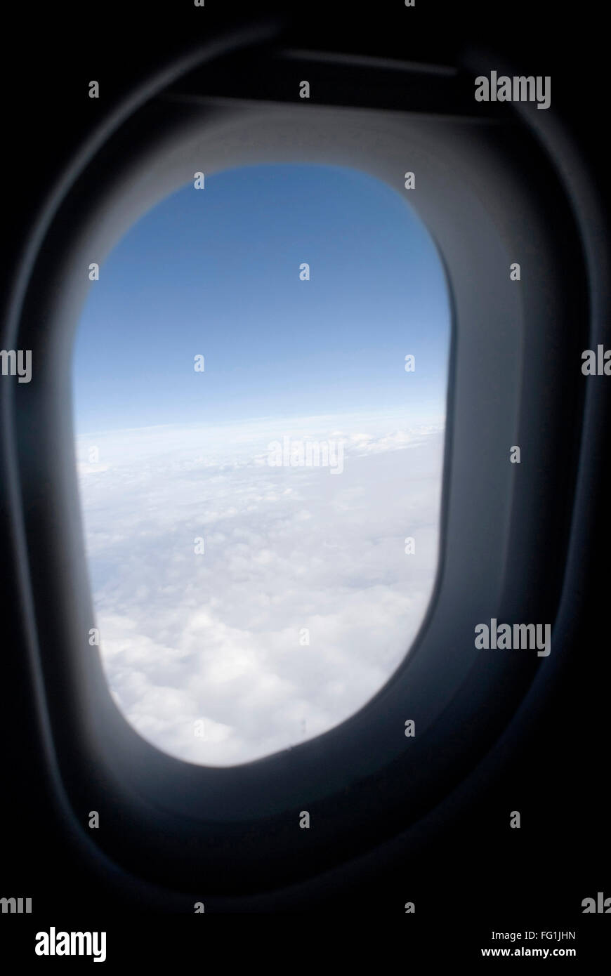 Clouds through aeroplane window Stock Photo - Alamy