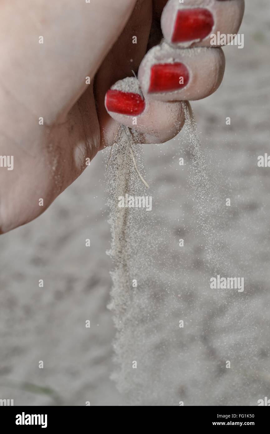 Hand pouring sand hi-res stock photography and images - Alamy