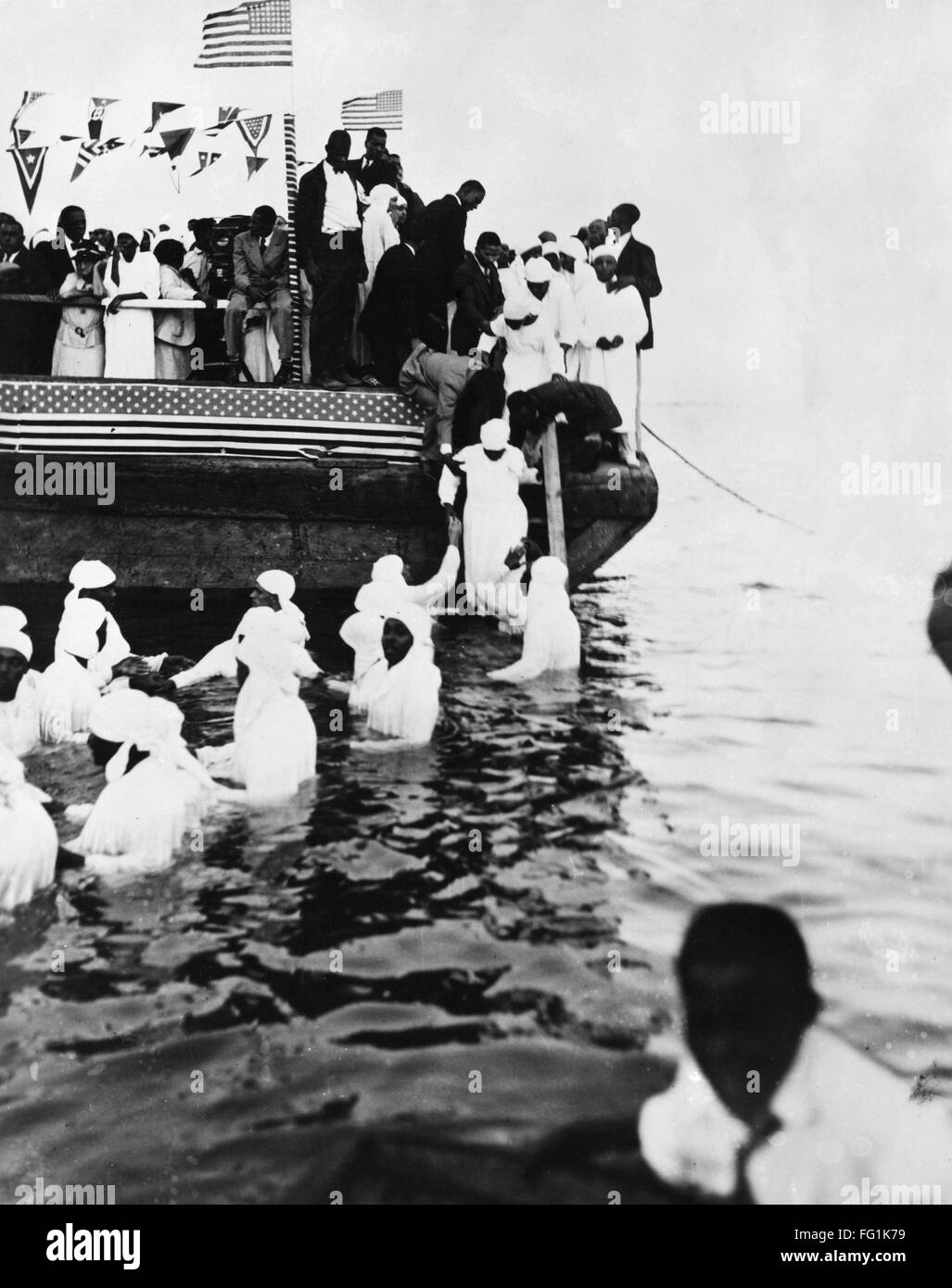 RIVER BAPTISM, c1925. /nMen and women being baptised in the James River ...