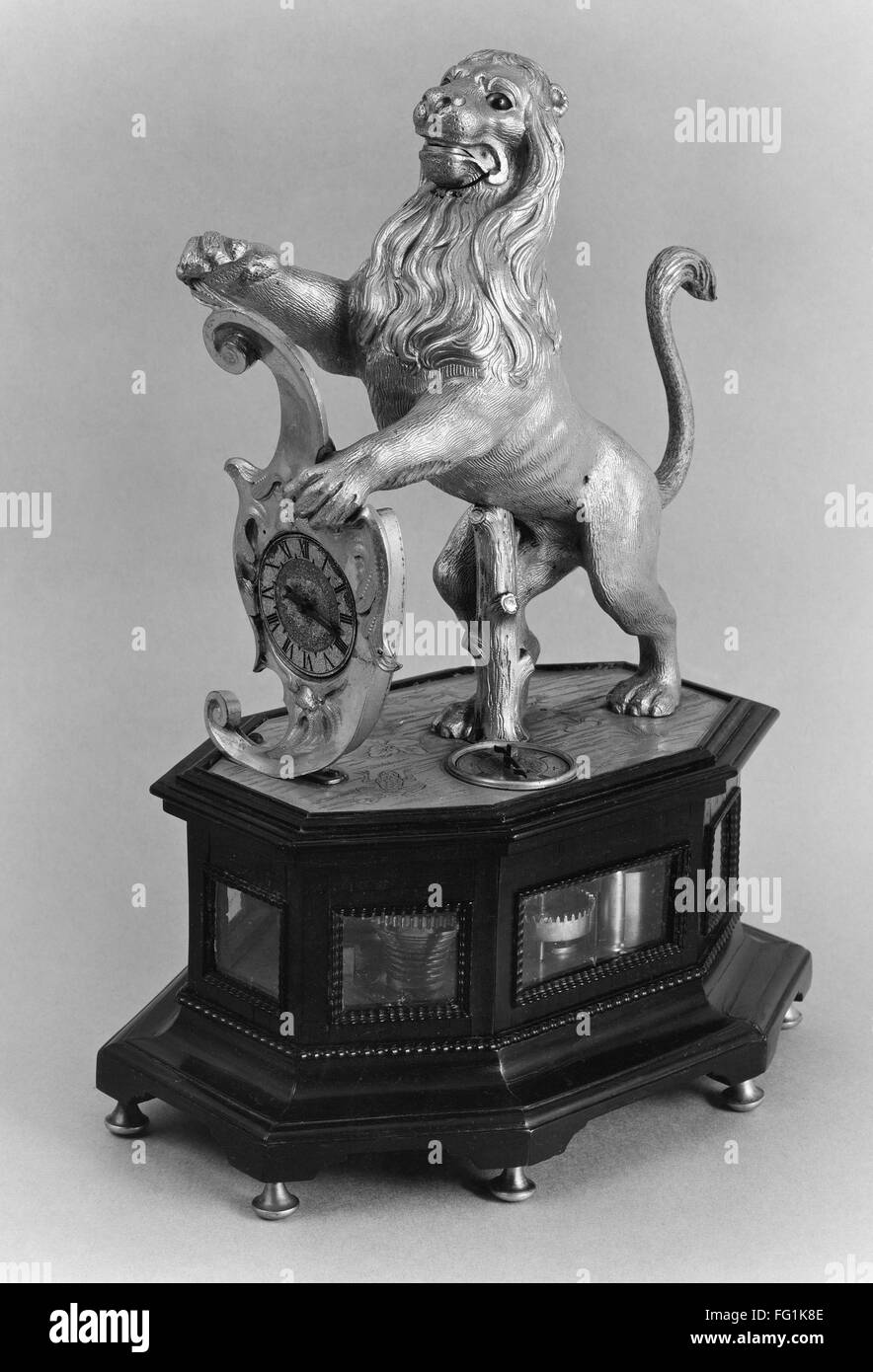 ANTIQUE CLOCK. /nAn antique clock with lion ornament Stock Photo - Alamy