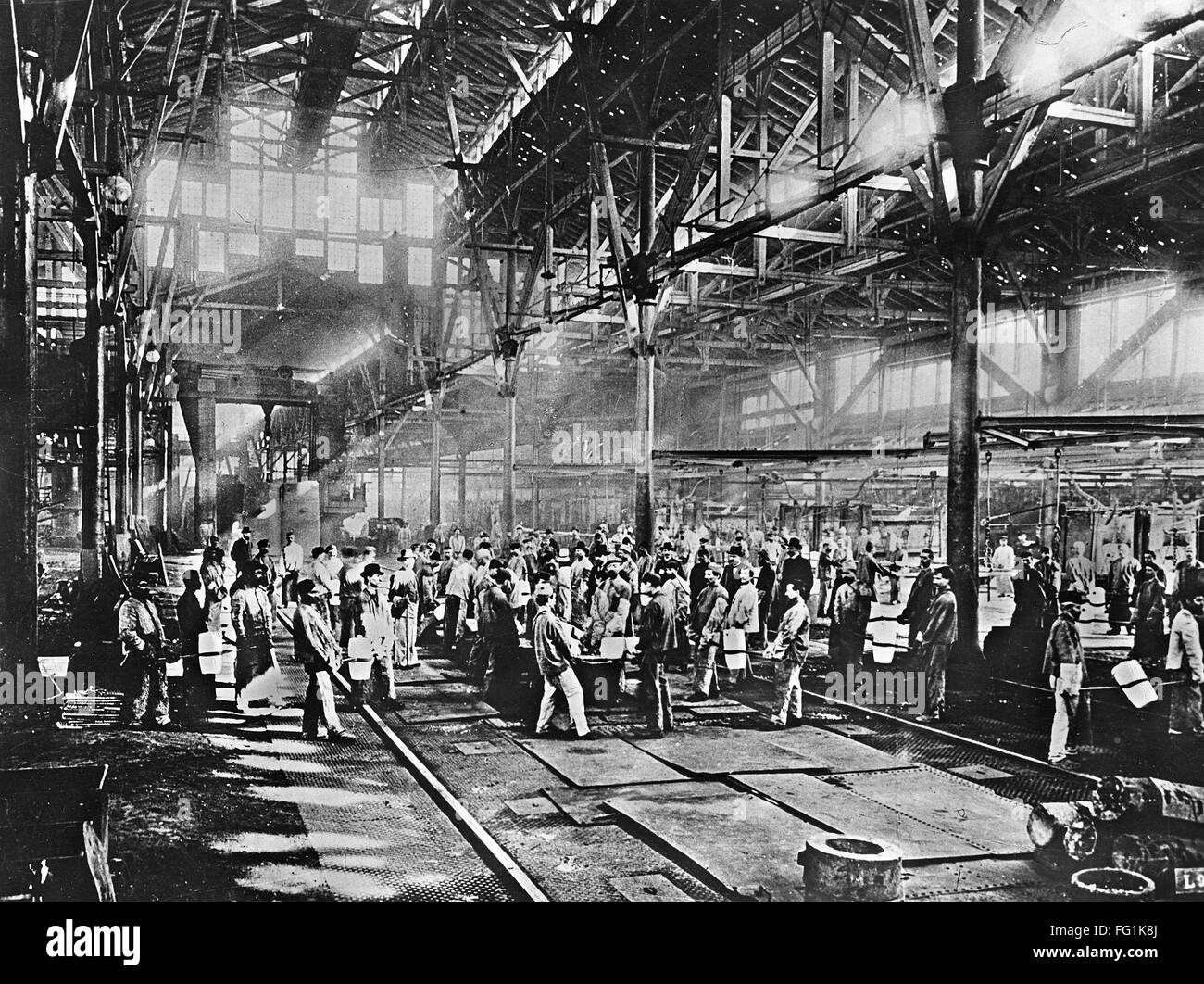 GERMANY: KRUPP WORKS. /nWorkers making a casting of crucible steel at ...