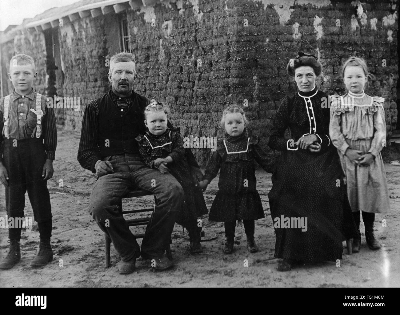 NEBRASKA: SETTLERS, 1900. /nA homesteader and family in front of their ...