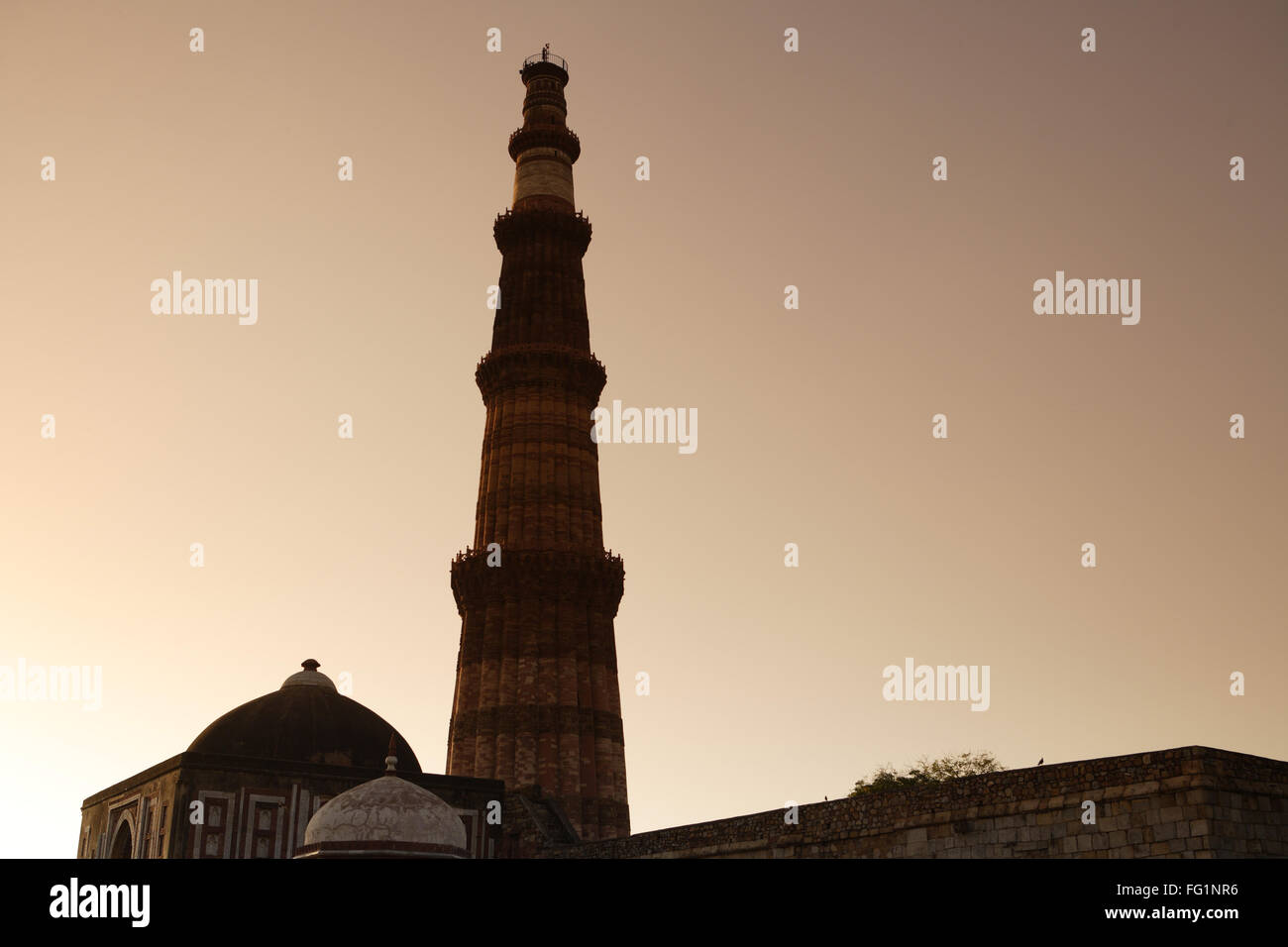 Sunset at Qutab Minar built in 1311 red sandstone tower , Indo Muslim ...