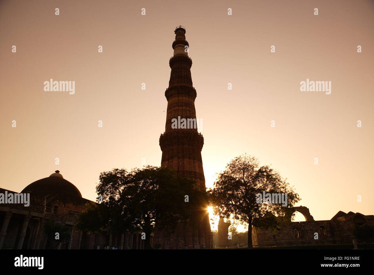 Sunset at Qutab Minar built in 1311 red sandstone tower , Indo Muslim ...
