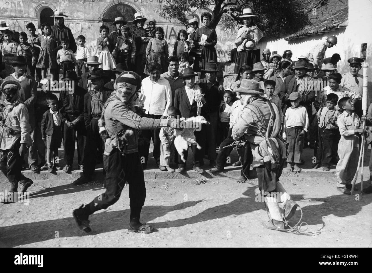 PERU, c1965. /nMen wearing knitted masks performing a dance or ritual ...