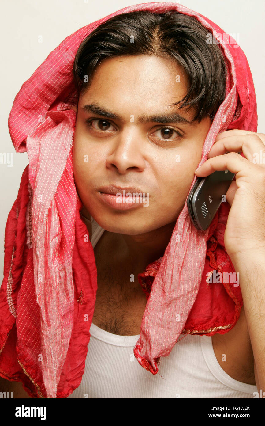 Indian teenage boy wearing white vest and red cloth called gamcha ...